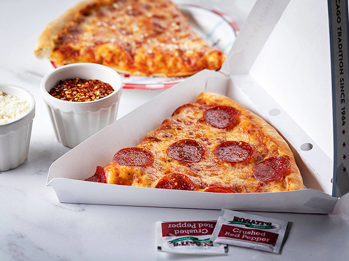 Pepperoni pizza slices await their destiny. In Chicago, even simple classics demand respect and proper cheese-to-sauce ratios.