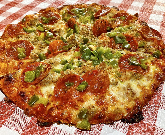 Pizza perfection isn't complicated: a well-seasoned crust, proper cheese-to-topping ratio, and those crispy pepperoni cups that collect just the right amount of oil.