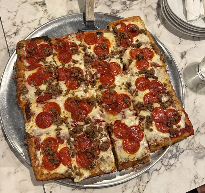 This square pizza doesn't cut corners on flavor &ndash; pepperoni and sausage playing the perfect duet on a stage of melted cheese.