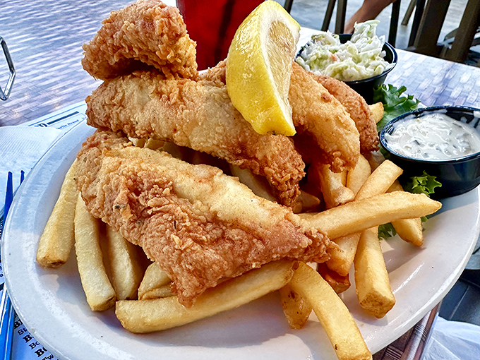 Golden-fried perch that shatters with each bite, paired with crispy fries. Lake Erie's finest catch transformed into comfort on a plate.