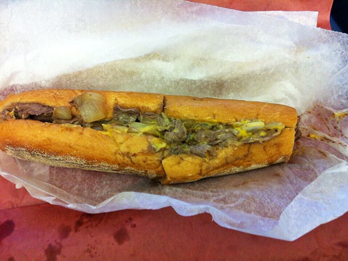 A true Philly classic&mdash;thinly sliced beef, melty cheese, and onions tucked into a warm, crusty roll.