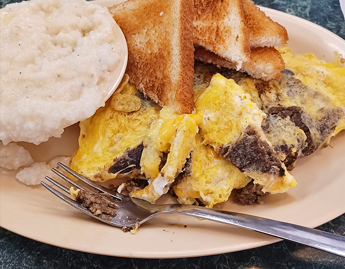 This isn't just an omelet&mdash;it's a beautiful marriage of eggs and fillings that would make any breakfast enthusiast weak at the knees.