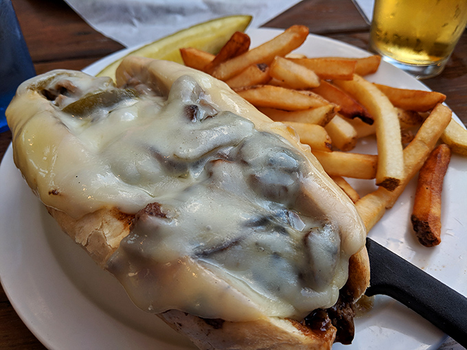 Melted cheese cascades over thinly sliced steak like a dairy waterfall of dreams. The Philly at Piper's doesn't just satisfy hunger&mdash;it creates devotion.