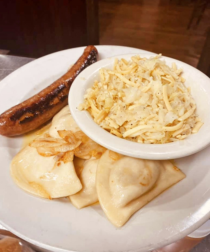 A Pennsylvania twist on Eastern European comfort: pierogies, kielbasa, and spaetzle share a plate in perfect harmony, like the world's most delicious United Nations.