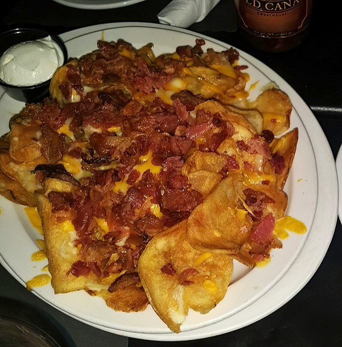 Pig Chips &ndash; where potato chips ascend to their highest calling, loaded with cheese, bacon, and absolutely zero regrets.