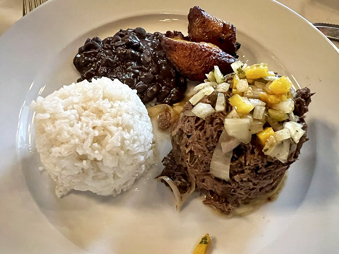 A Cuban classic: tender ropa vieja with black beans, white rice, and sweet plantains. It's comfort food that gives your grandmother's cooking a run for its money.