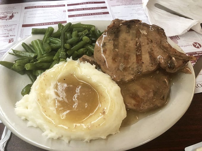 These pork chops aren't just cooked, they're loved into existence. The gravy pool isn't just a sauce&mdash;it's a destination worth visiting.