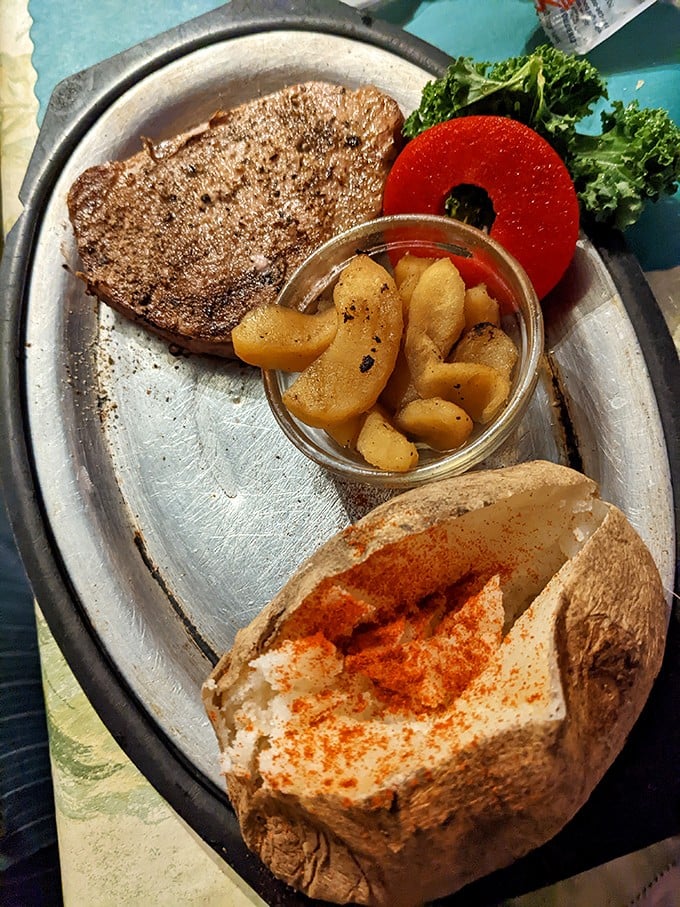 A proper supper club meal: steak, baked potato with all the fixings, and the obligatory garnish. Simple perfection that needs no reinvention or apology.