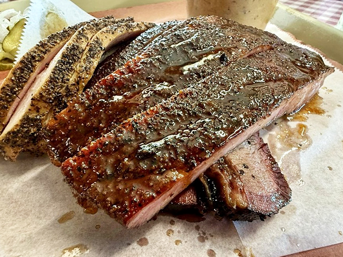 These ribs showcase the kind of bark that makes pitmasters weep with professional jealousy.