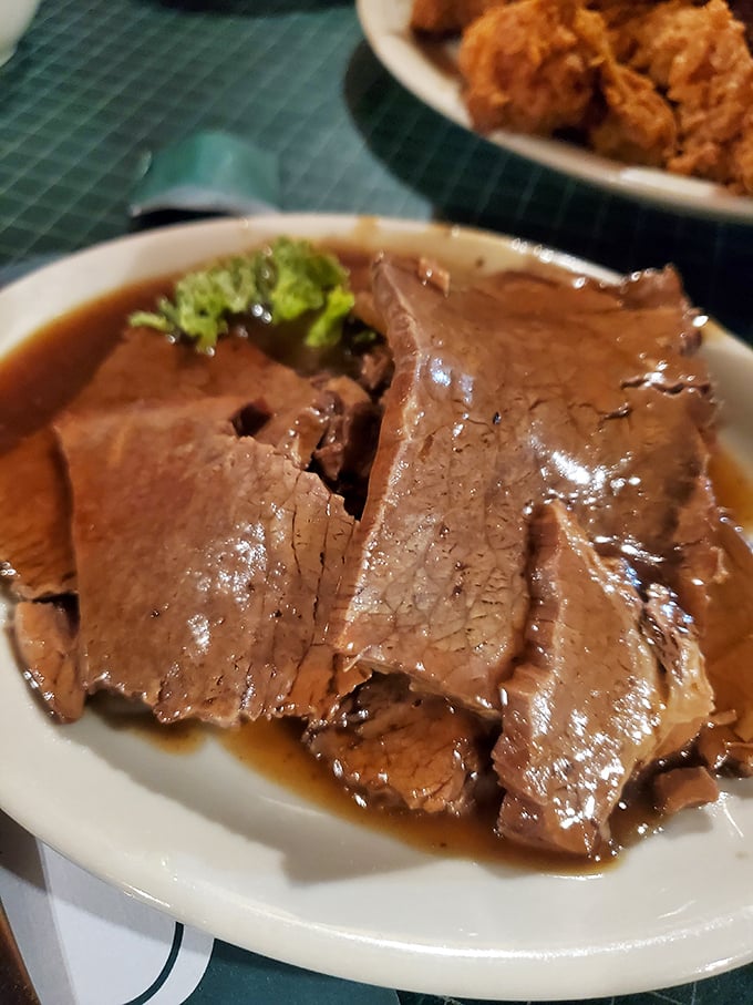 Pot roast so tender it practically surrenders to your fork, swimming in gravy that deserves its own love song.