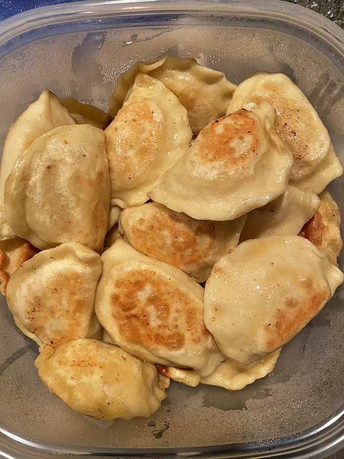 These potato and cheese pierogies gleam like edible gold coins waiting to be devoured.
