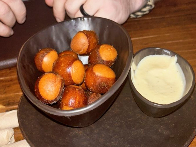 Golden pretzel bites that practically glow, begging to be dunked in that honey mustard like it's their job.