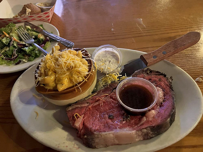 This prime rib isn't just dinner&mdash;it's a carnivore's dream come true, perfectly pink and served with a side of cheesy goodness.