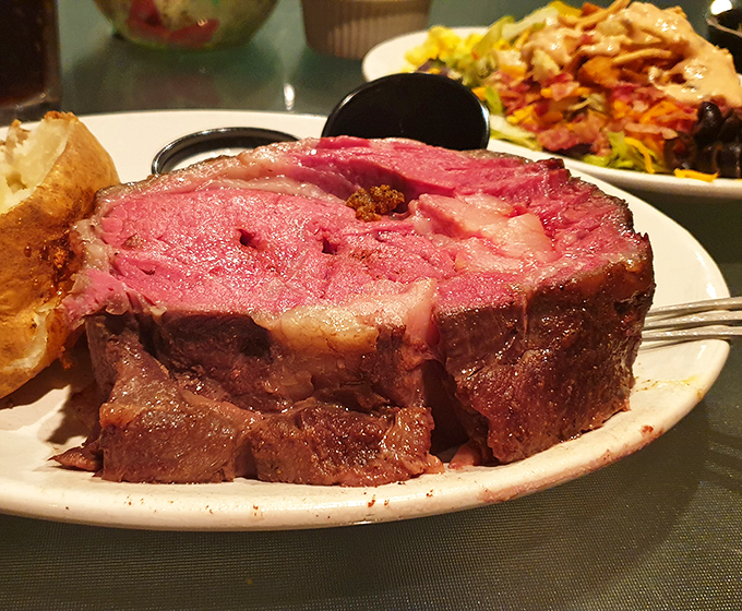 Prime rib so perfectly cooked it makes you wonder if there's a beef whisperer in the kitchen. That pink center is nature's way of saying "you're welcome."