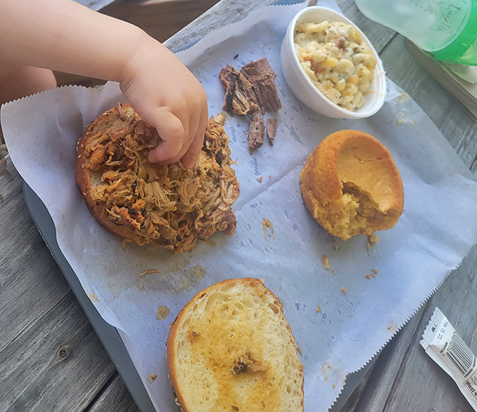 Someone's about to experience the joy of pulled meat on fresh bread with creamy mac 'n cheese&mdash;a happiness that transcends all age groups.