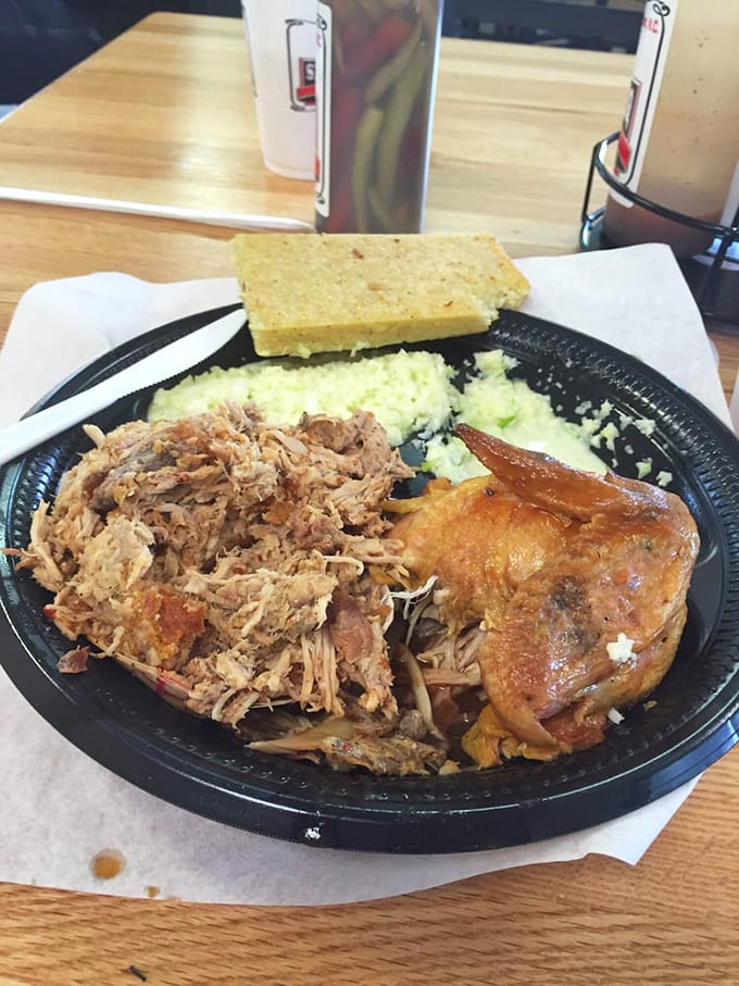 The holy trinity of Eastern Carolina barbecue: chopped whole hog with cracklins mixed in, vinegar slaw, and that distinctive cornbread that's unlike any other.