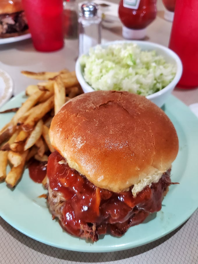 Not just a sandwich, but an architectural marvel of slow-roasted beef, tangy sauce, and a bun that knows its supporting role.