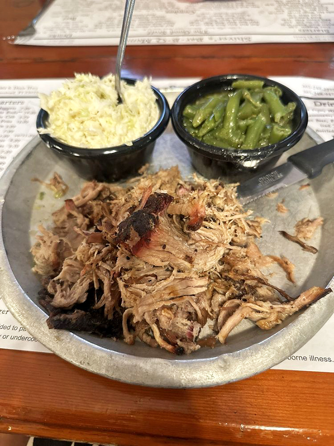 Pulled pork that's been introduced to smoke and time, served with no-nonsense sides. Simplicity that speaks volumes about priorities.