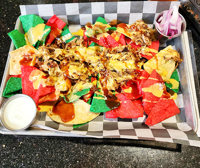 These colorful pulled pork nachos don't just cross borders&mdash;they demolish them, creating a United Nations of flavor on a single tray.
