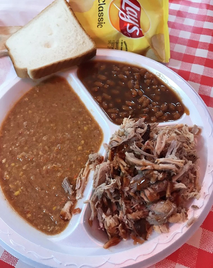 This pulled pork plate isn't just a meal, it's a Southern handshake. The Brunswick stew and baked beans complete barbecue's holy trinity.