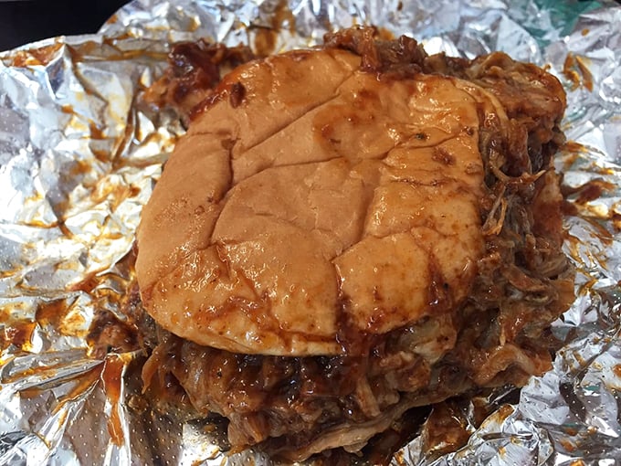 The pulled pork sandwich doesn't need fancy presentation&mdash;just a humble bun struggling heroically to contain a mountain of smoky, saucy perfection.
