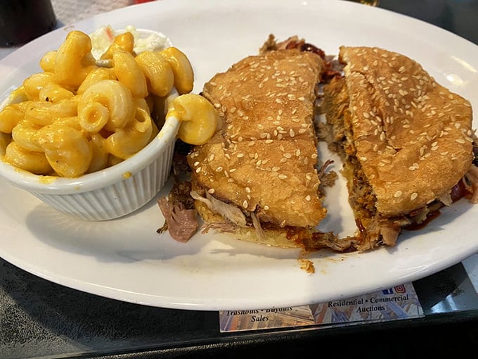 This pulled pork sandwich with mac and cheese isn't just lunch &ndash; it's a commitment to excellence that requires both hands and several napkins.
