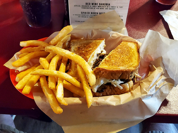 This pulled pork sandwich isn't just a meal, it's an event. Golden fries stand guard beside the main attraction.