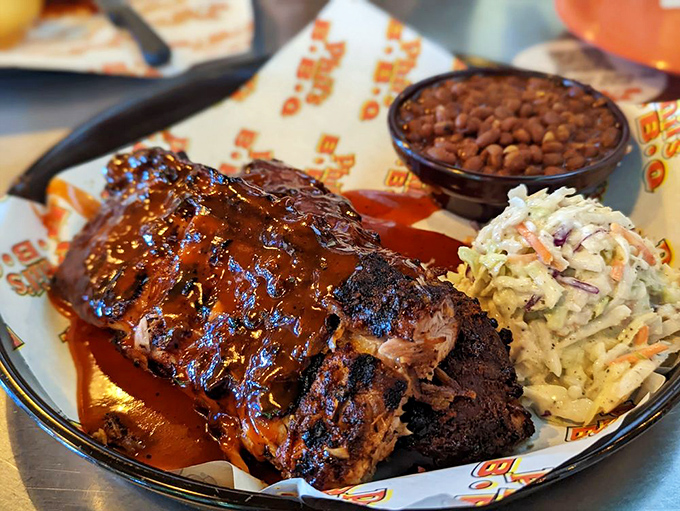 Ribs so perfectly lacquered they belong in a museum, served with sides that know their supporting role in this meaty blockbuster.