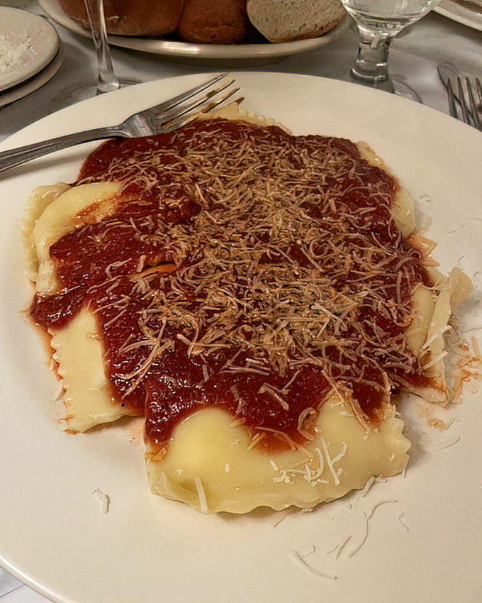 Ravioli bathed in that signature red gravy and showered with cheese&mdash;like little pasta pillows having the best day of their lives.