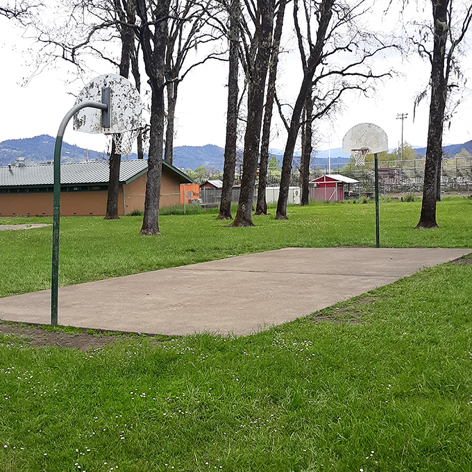 The local basketball court sits ready for pickup games, where "senior league" players prove age is just a number&mdash;usually followed by "ice pack."