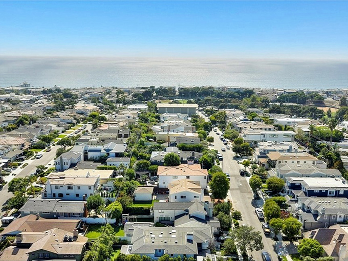 The residential streets of Manhattan Beach reveal a neighborhood where even the telephone poles probably have higher property values than most homes.