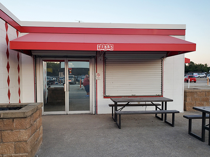 The red awning and picnic tables welcome hungry moviegoers. This isn't just a concession stand&mdash;it's intermission headquarters.