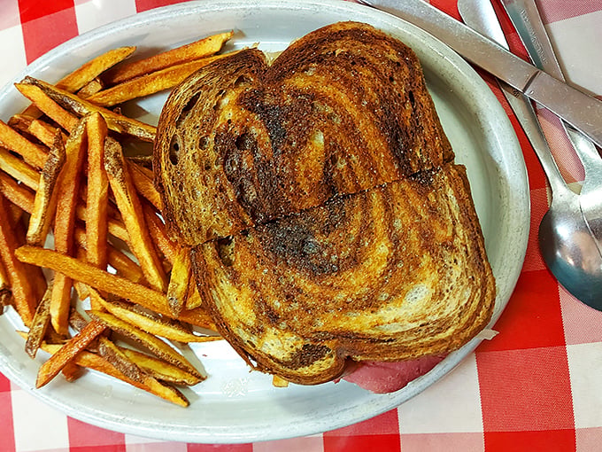 This isn't just a grilled sandwich &ndash; it's a masterclass in texture, with golden-brown bread giving way to melty goodness alongside crispy fries.