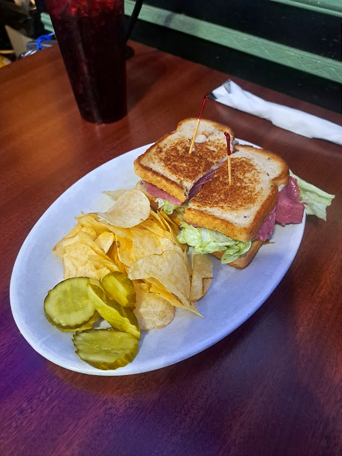 This towering Reuben sandwich proves that sometimes the best things in life require both hands and zero shame.