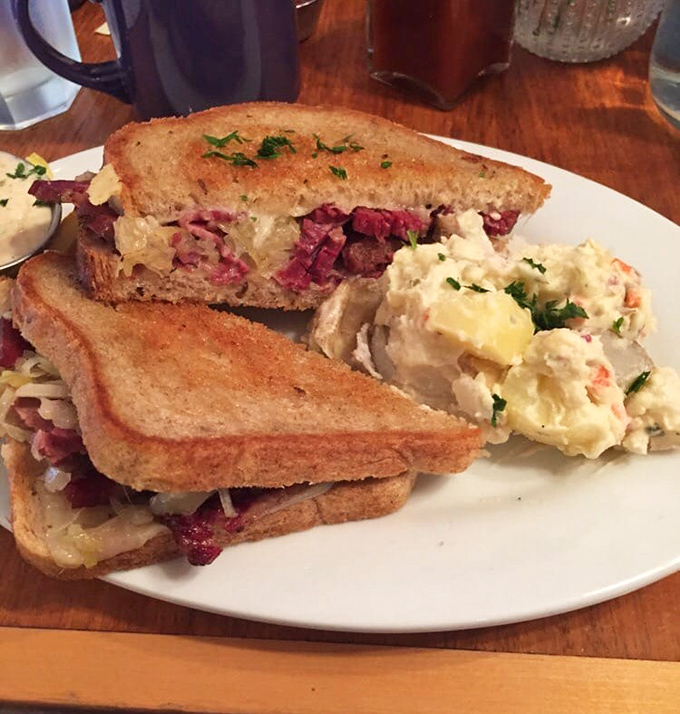 The Reuben at Lucky's isn't just a sandwich; it's architecture, history, and pure deliciousness between two perfectly toasted slices of rye.