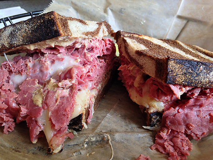The Reuben here doesn't just satisfy hunger &ndash; it resolves existential crises with its perfect marriage of corned beef, sauerkraut, and melted Swiss.