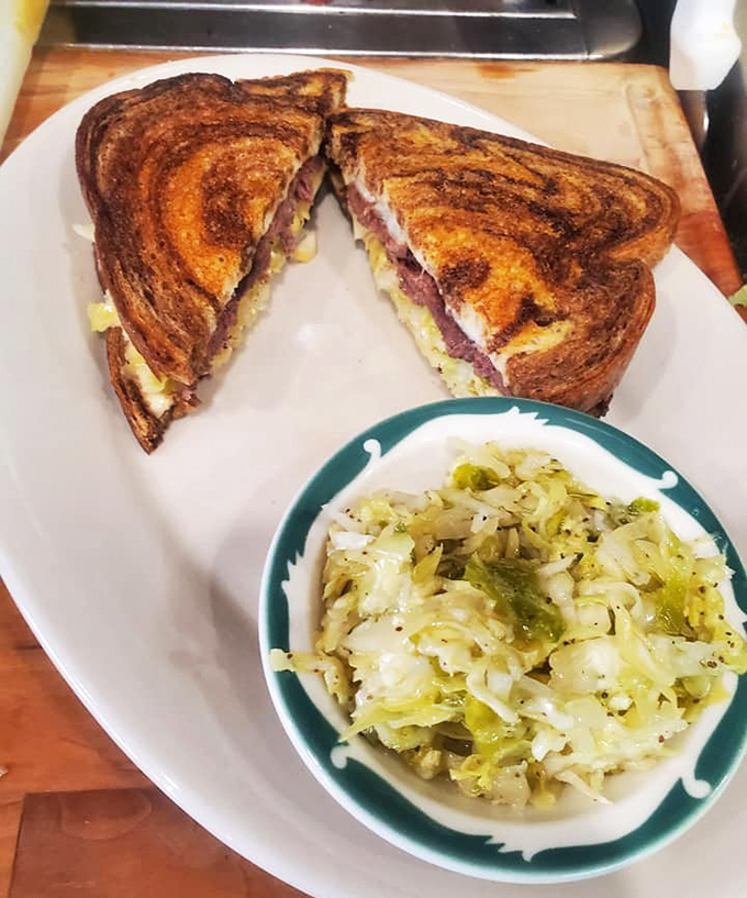 A perfectly grilled sandwich with a side of buttery cabbage &ndash; proof that simple food done right is worth more than any fancy tasting menu.