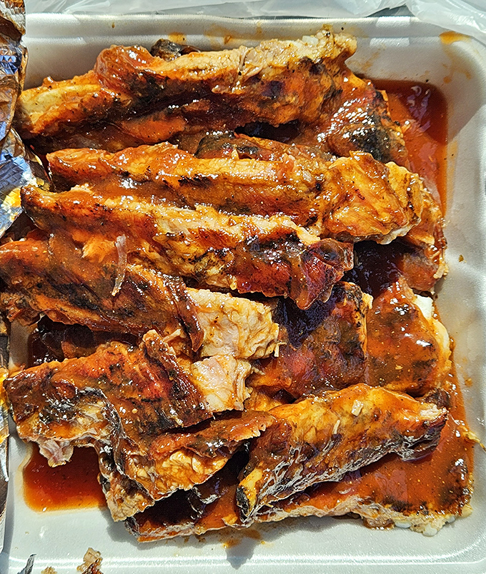 These ribs aren't just falling off the bone&mdash;they're practically volunteering to jump onto your plate, swimming in a sauce worth bottling and hoarding.