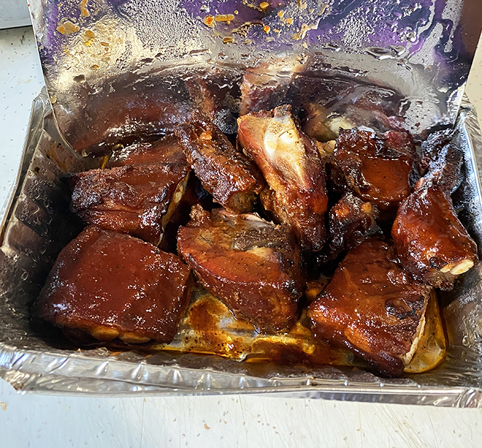 These rib tips aren't just cooked, they're coaxed into deliciousness. The glistening sauce is practically winking at you.