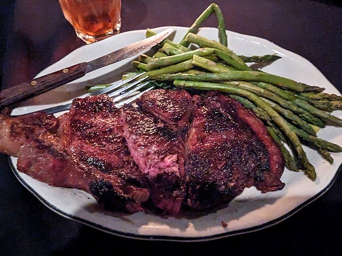 This ribeye with grilled asparagus isn't just dinner&mdash;it's a celebration of fire meeting beef in perfect harmony. The char speaks volumes.