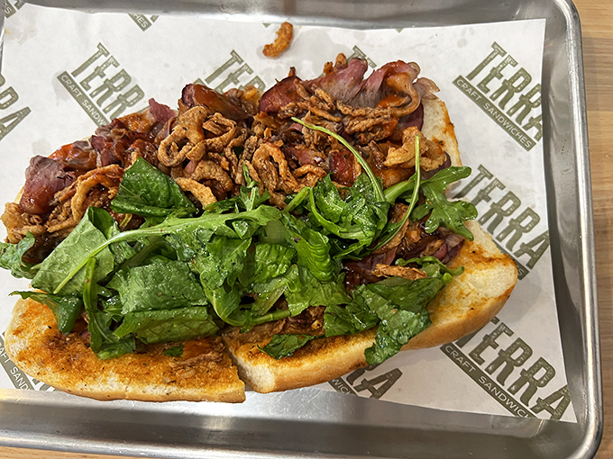 Crispy meets fresh in this open-faced masterpiece where arugula and bacon create the kind of harmony that would make Simon and Garfunkel jealous.