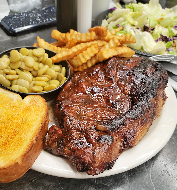 This isn't just dinner; it's edible art. The brisket's glistening surface promises a flavor explosion that'll haunt your dreams.