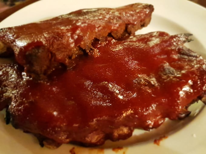 Fall-off-the-bone ribs slathered in sauce that's worth the shirt stain. Some foods require a commitment to messiness—these ribs demand it.