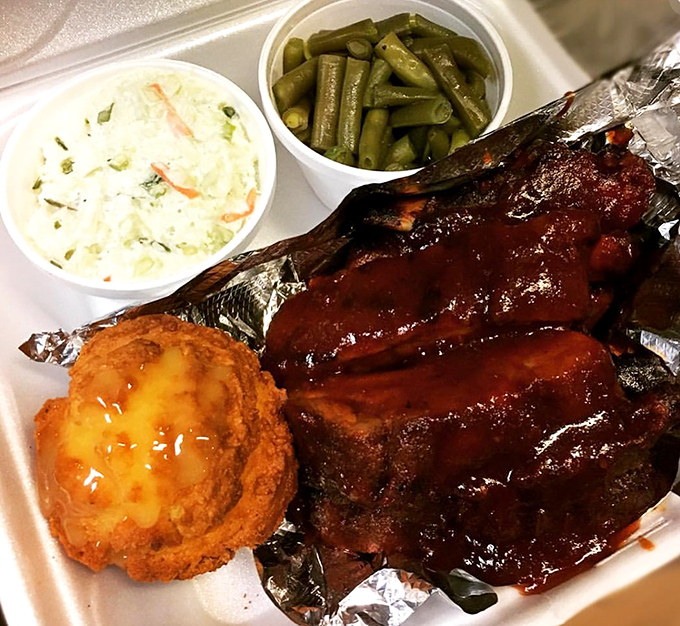 Barbecue ribs that fall off the bone with less resistance than I show to dessert menus. That cornbread and slaw aren't just sides &ndash; they're supporting actors deserving their own award.