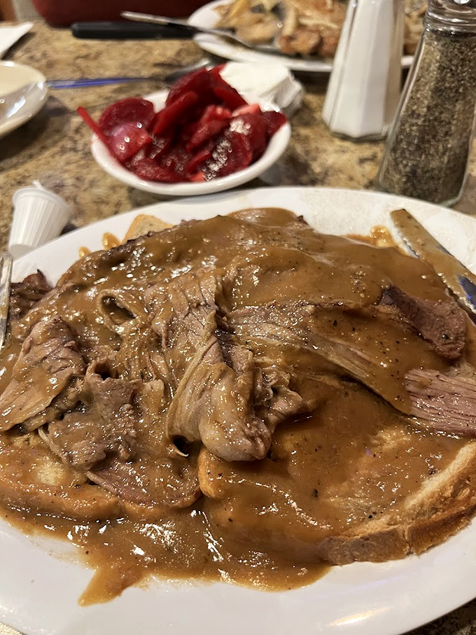 This isn't just roast beef &ndash; it's a gravy-laden love letter to comfort food that whispers, "Diet? What diet?"