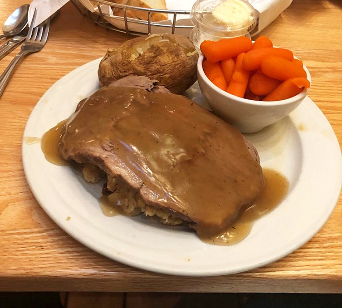 Comfort food doesn't get more comforting than this&mdash;tender roast beef swimming in gravy with a baked potato standing by for backup.
