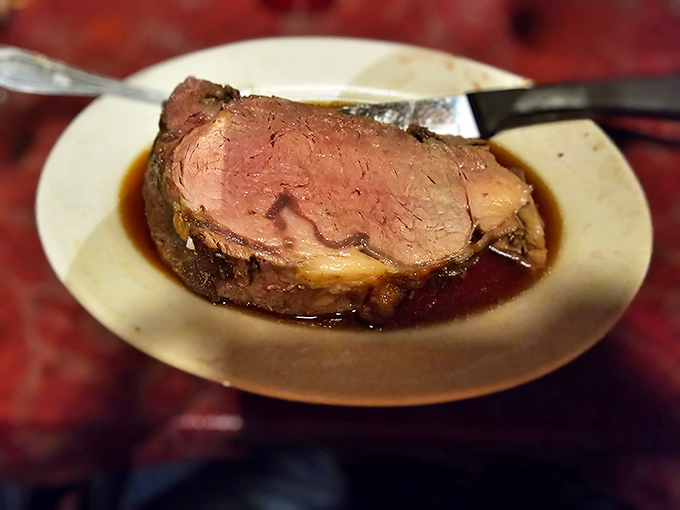 Roast beef so tender it practically surrenders to your fork, glistening with juices that tell stories of slow-roasting perfection.