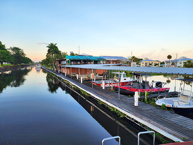 Roland Martin Marina at sunset &ndash; where boats rest after a day's adventure and the water reflects the sky's artwork better than any museum could. 