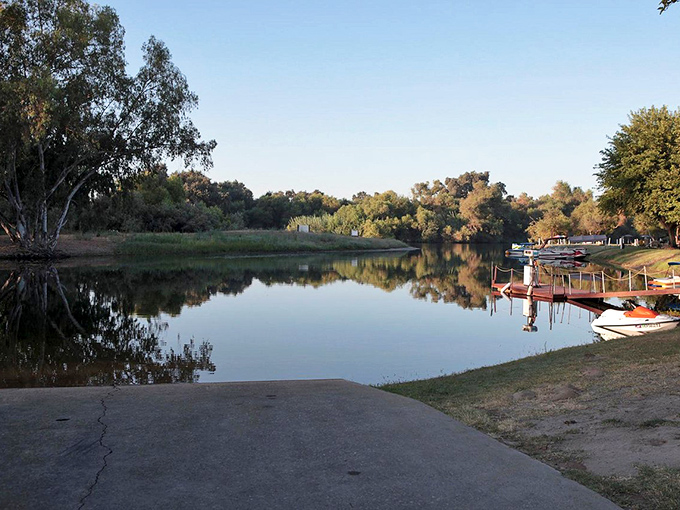 Royal Oak RV Resort offers travelers a peaceful respite with tree-lined shores and glassy waters. Perfect for morning coffee contemplation.