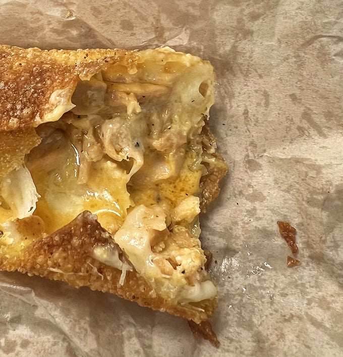 Crispy exterior gives way to molten cheese and savory filling. Like biting into a dream you didn't know you had until this very moment.